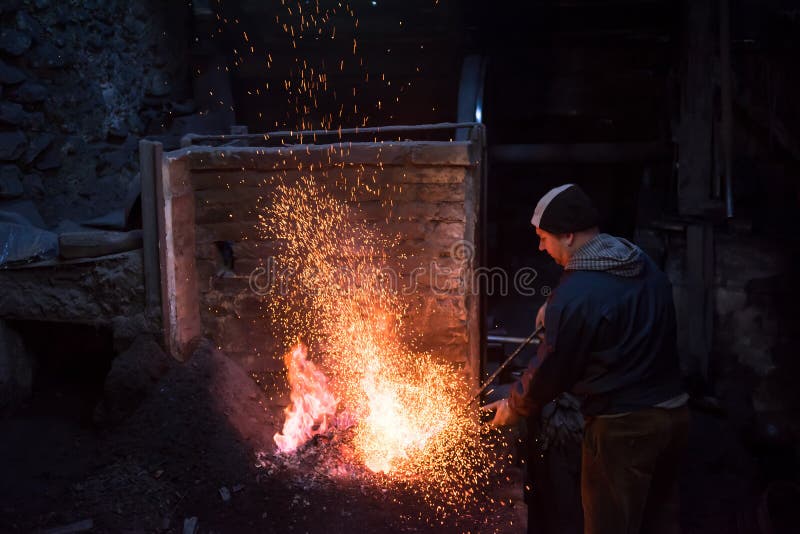 Young Traditional Blacksmith Working with Open Fire Stock Image - Image ...