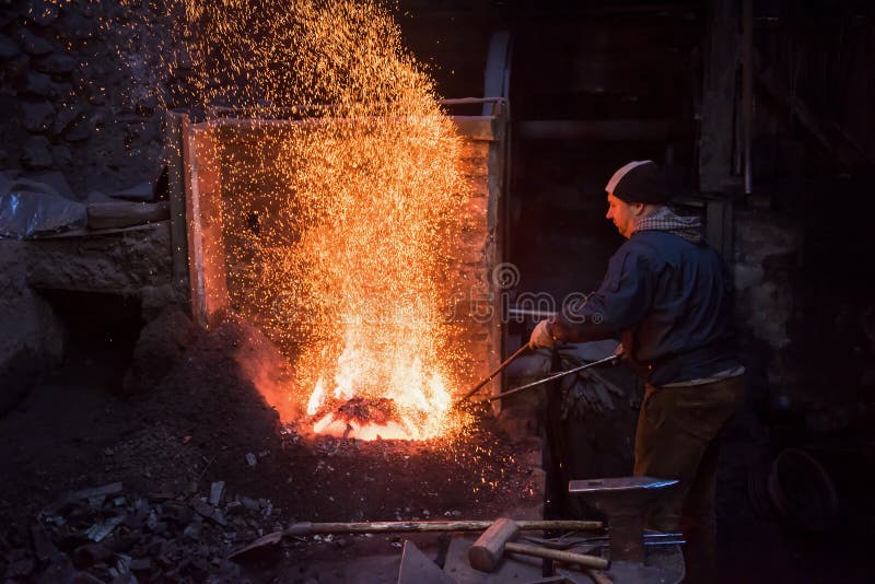 Young Traditional Blacksmith Working with Open Fire Stock Photo - Image ...