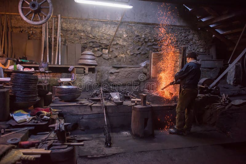 Young Traditional Blacksmith Working with Open Fire Stock Photo - Image ...