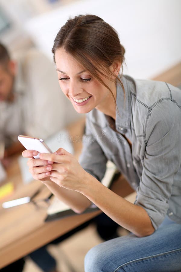 Young Trainee in Business Class Using Smartphone Stock Photo - Image of ...