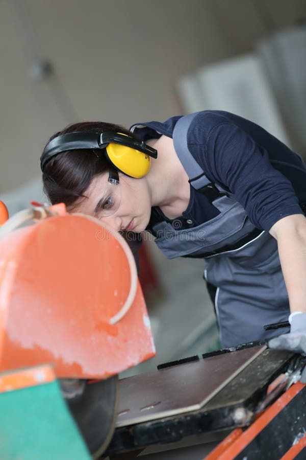 Young Trainee in Professional Training Using Tile Grinder Stock Photo ...