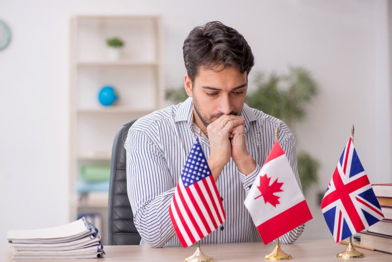 Young Male Translator Sitting in the Office Stock Image - Image of ...