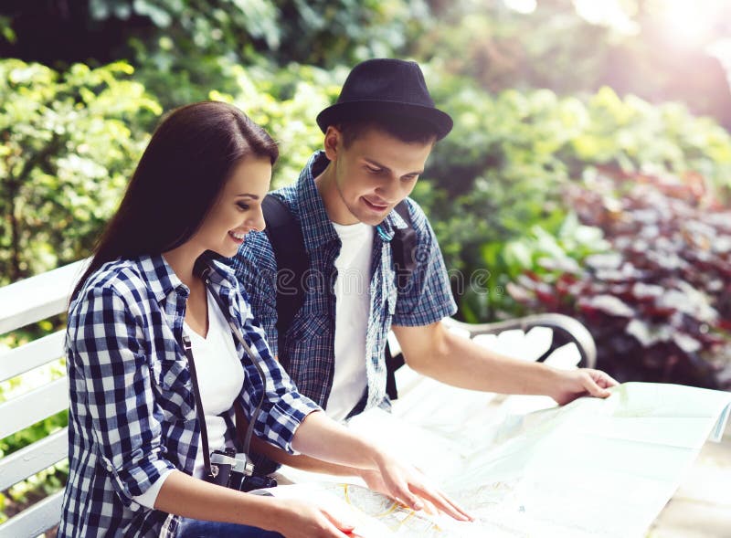 Young Traveling Couple Checking Out the Map in the Park. Stock Image ...