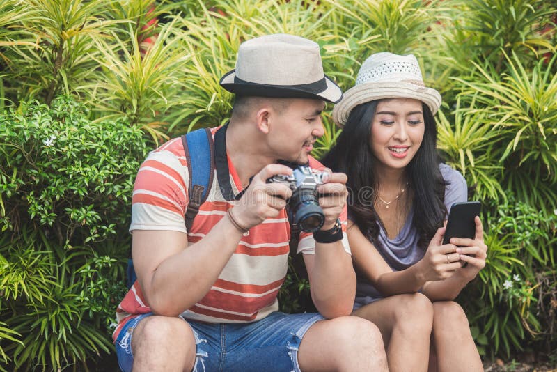 Young Travellers Taking a Rest on the Side of the Road during Su Stock ...