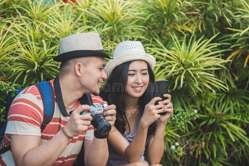 Young Travellers Taking a Rest on the Side of the Road during Su Stock ...