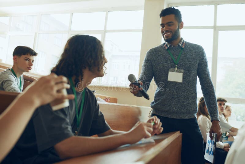 Young Tutor, Teacher Lesson Lesson in University, Communicating and ...