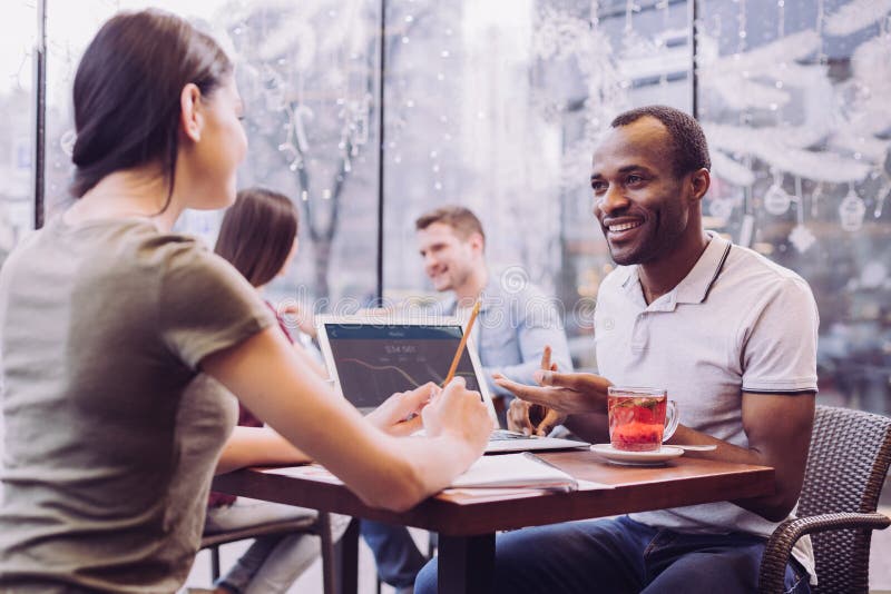 Young Two Colleagues Cooperating at Cafe Stock Photo - Image of ...