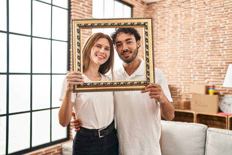 Young Two People Holding Empty Frame Together Smiling with a Happy and ...