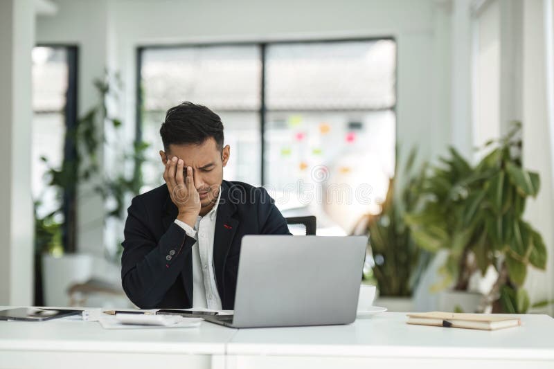 Young Unhappy Man Office Worker Feeling Bored at Work, Looking at ...
