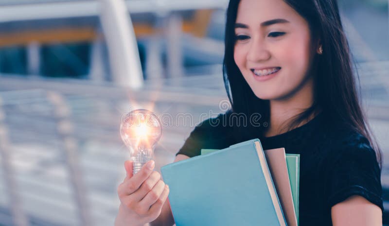 Young University Student Holding Light Bulb,creative Idea Stock Image ...