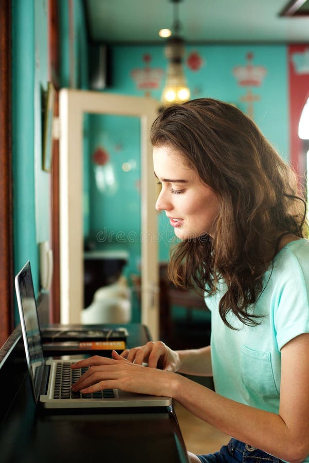 Young University Student Studying on Laptop at Cafe Stock Photo - Image ...