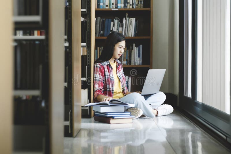 Young University Student Using Laptop for Online Learning, Searching ...