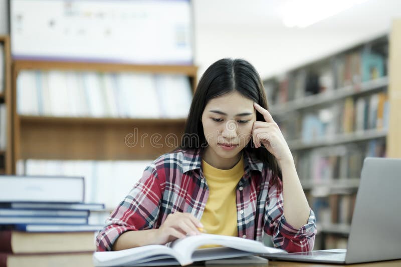 Young University Student Using Laptop for Online Learning, Searching ...