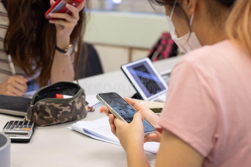 Young University Students or Business People Note and Analyze Data ...