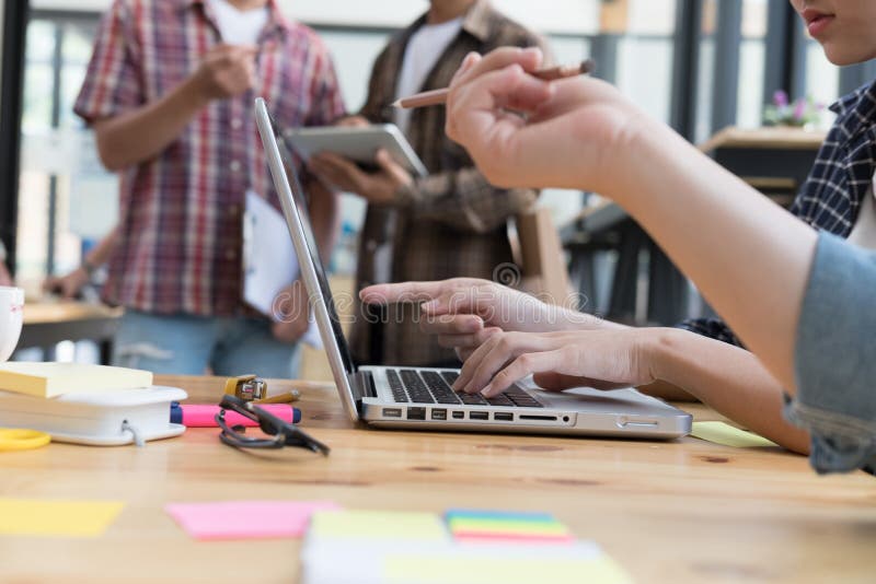 Young University Students Studying with Computer in Cafe. Group Stock ...