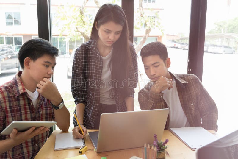 Young University Students Studying with Computer and Tablet in C Stock ...