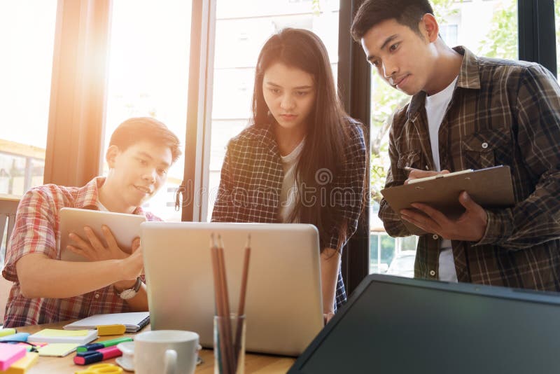 Young University Students Studying with Computer in Cafe. Group Stock ...