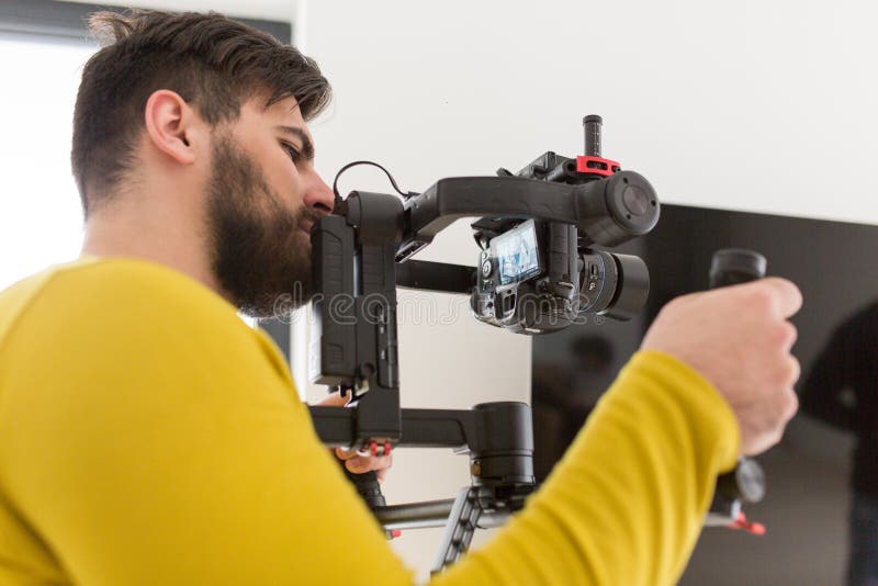 Videographer at work stock image. Image of filmmaking - 103865249