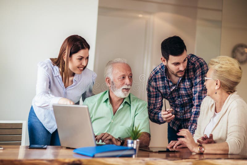 Volunteers Help Senior People on the Computer. Young People Giving ...