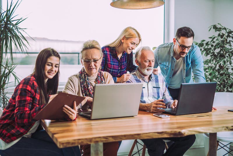 Volunteers Help Senior People on the Computer Stock Image - Image of ...