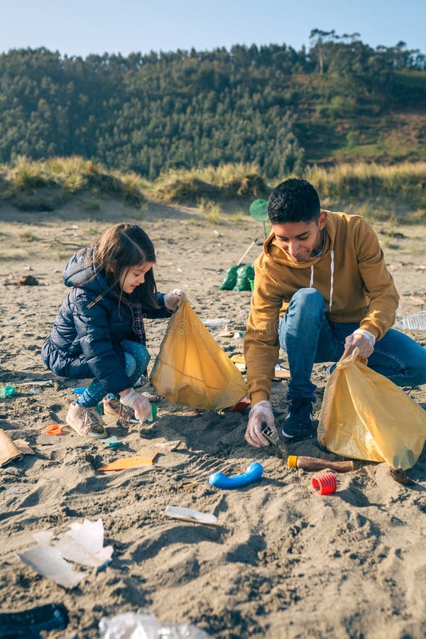 Young Volunteers Cleaning the Beach Stock Image - Image of beach ...