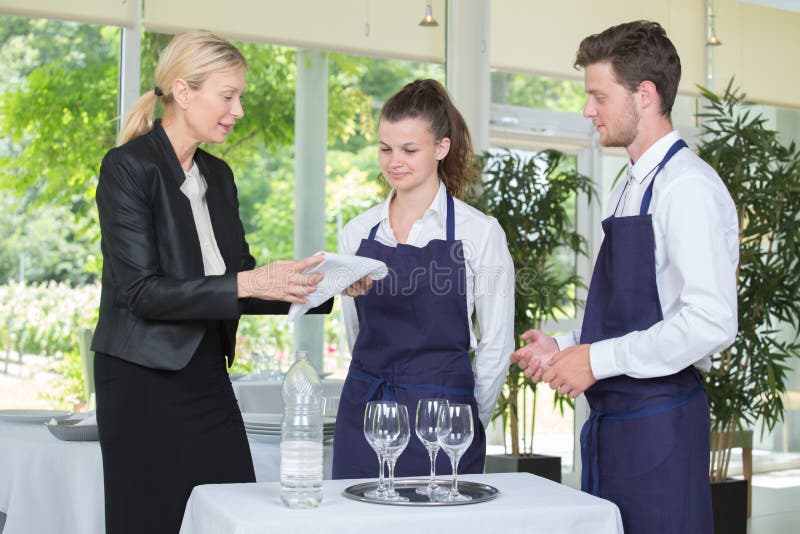 Restaurant Waitress Giving Menu To Customers Stock Image - Image of ...