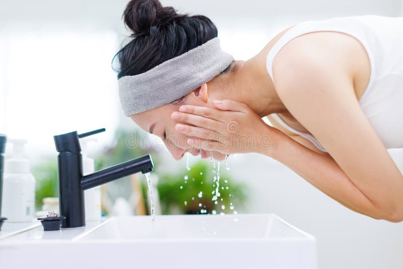 Young washing her face stock image. Image of cleansing - 299913179