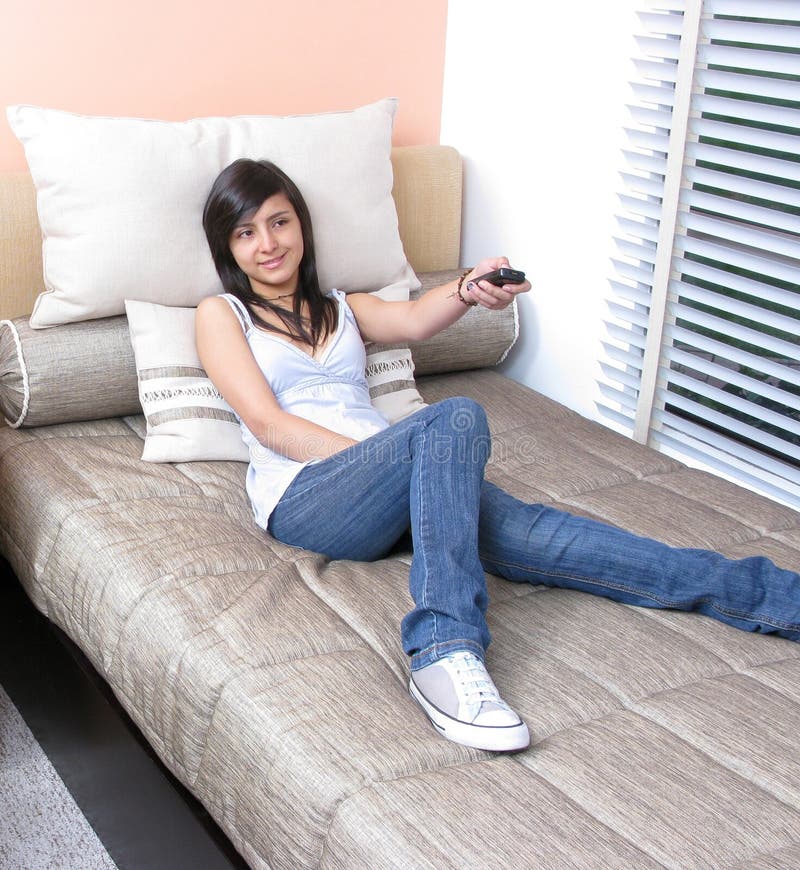 Young watching TV al home stock image. Image of chatting - 15127451