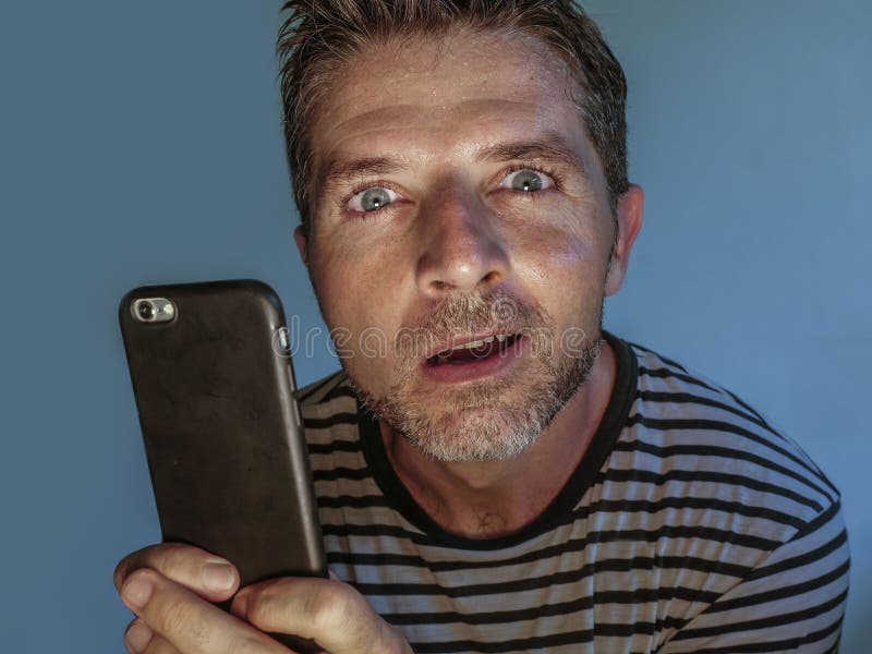 Young Weird and Crazy Mobile Phone Addict Man Using Cell Compulsively ...