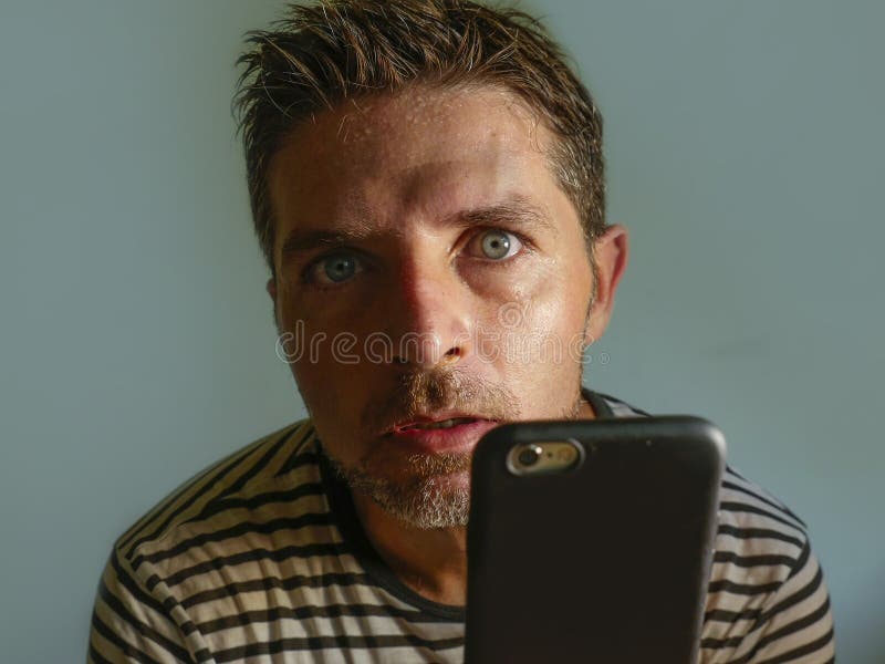 Young Cell Phone Addict Man Awake at Night in Bed Using Smartphone ...
