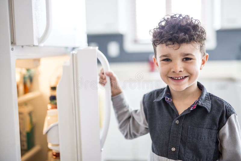 Young White Boy Standing in Front of Open Refrigerator. Stock Image ...