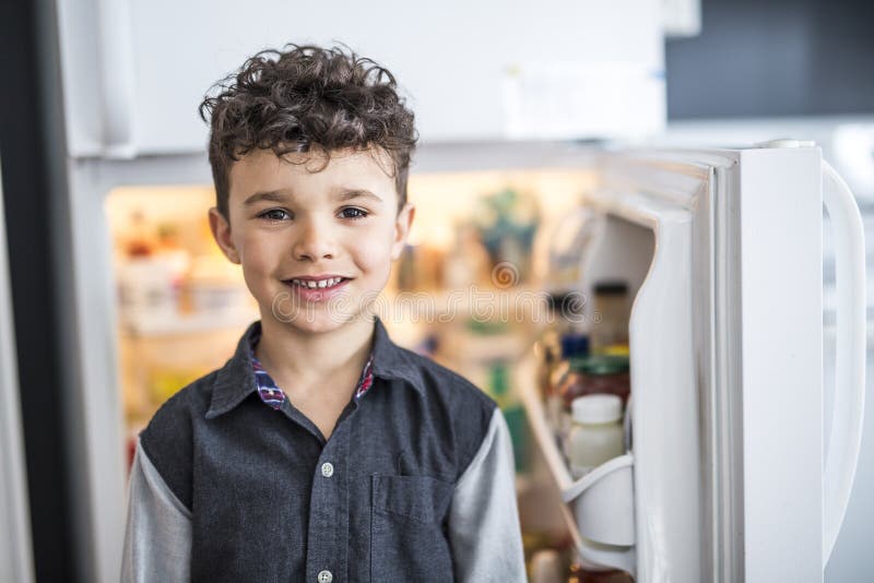 Young White Boy Standing in Front of Open Refrigerator. Stock Image ...