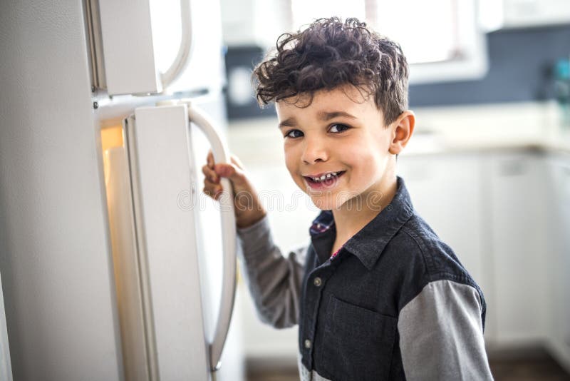 Young White Boy Standing in Front of Open Refrigerator. Stock Image ...