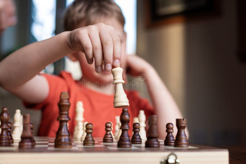 Young White Child Playing a Game of Chess on Large Chess Board. Chess ...
