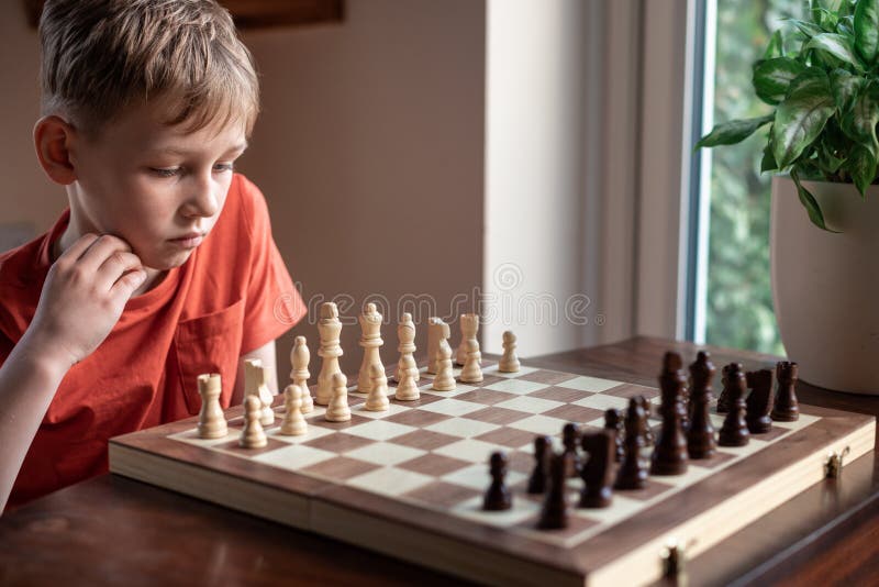 Young White Child Playing a Game of Chess on Large Chess Board. Chess ...