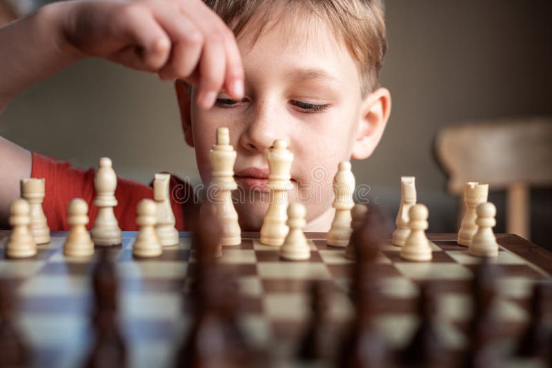 Young White Child Playing a Game of Chess on Large Chess Board. Chess ...