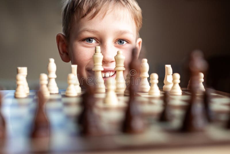 Young White Child Playing a Game of Chess on Large Chess Board. Chess ...