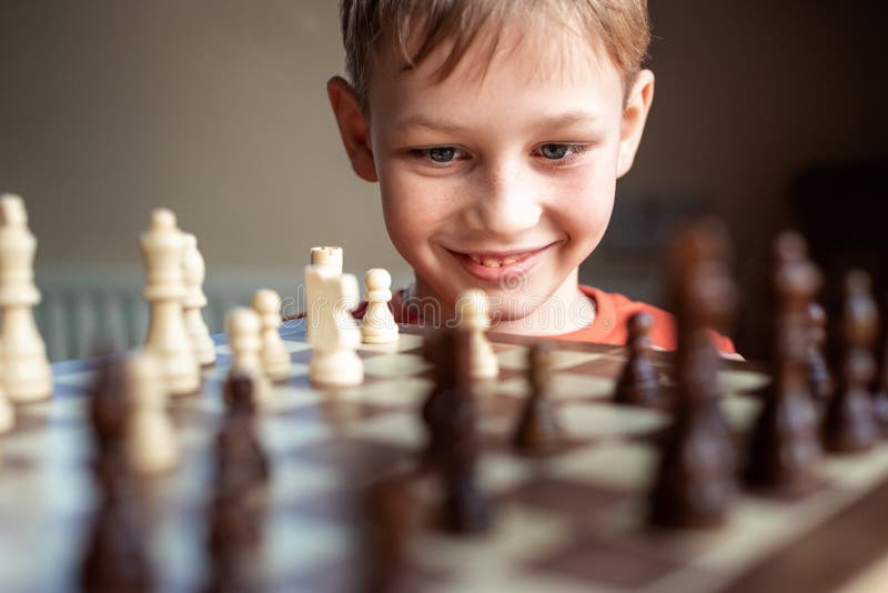 Young White Child Playing a Game of Chess on Large Chess Board. Chess ...