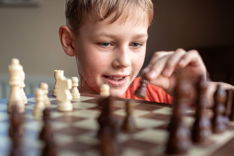 Young White Child Playing a Game of Chess on Large Chess Board. Chess ...