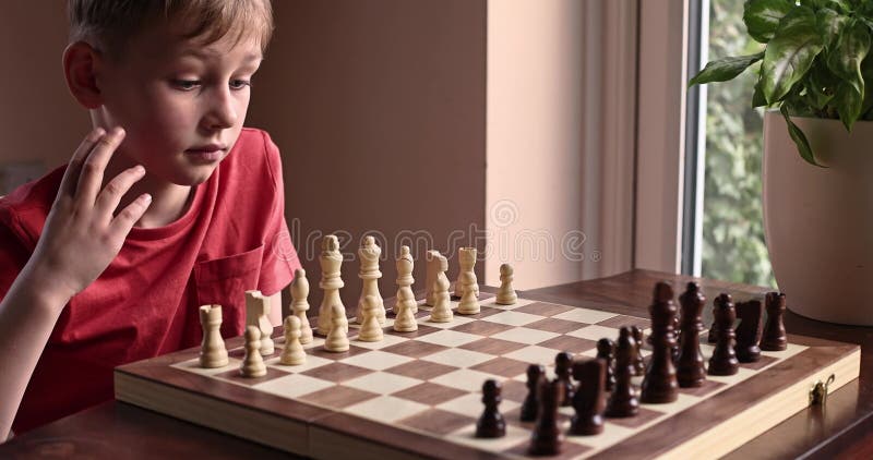 Young White Child Playing a Game of Chess on Large Chess Board. Chess ...