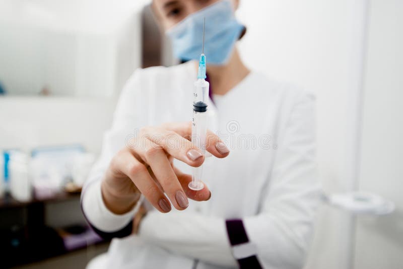 Young White Doctor with Syringe is Ready To Make Injection Stock Image ...