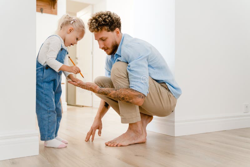 Young White Father Smiling and Having Fun with His Daughter at Home ...