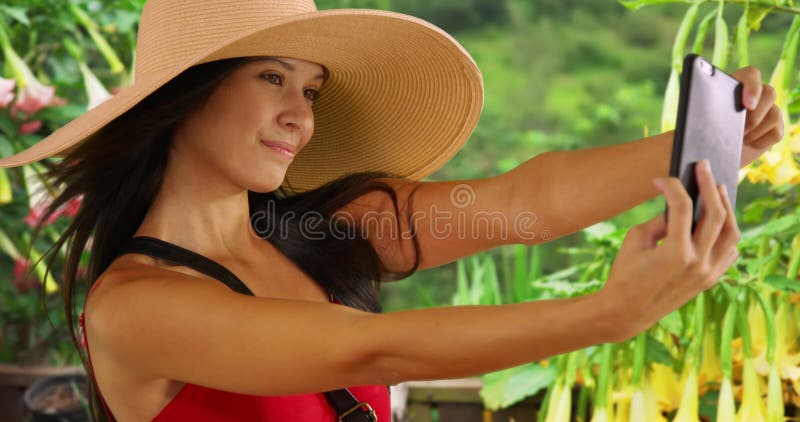 Young White Girl Thinking While Sitting At A Caf Table Holding Her