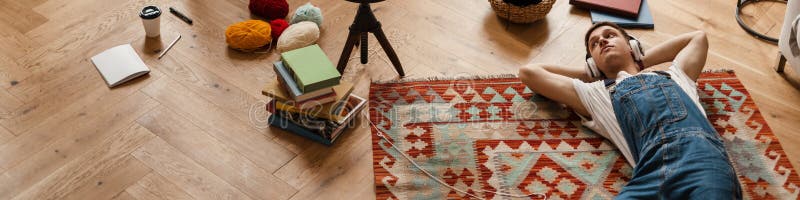Young White Man in Headphones Resting while Working on Craft Rug Stock ...