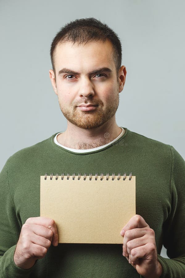 A Young White Man Holds a Notebook. Concept Training, Internship ...