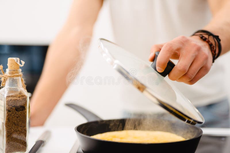 Young Man with Frying Pan and Spatula, Isolated Stock Photo - Image of ...