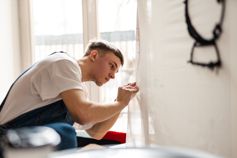 Young White Man Wearing Overall Working on Craft Rug Stock Photo ...