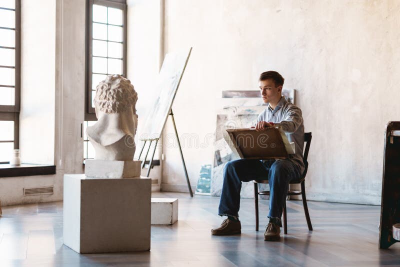 Young White Student Drawing Plaster Bust during Class in Art School ...