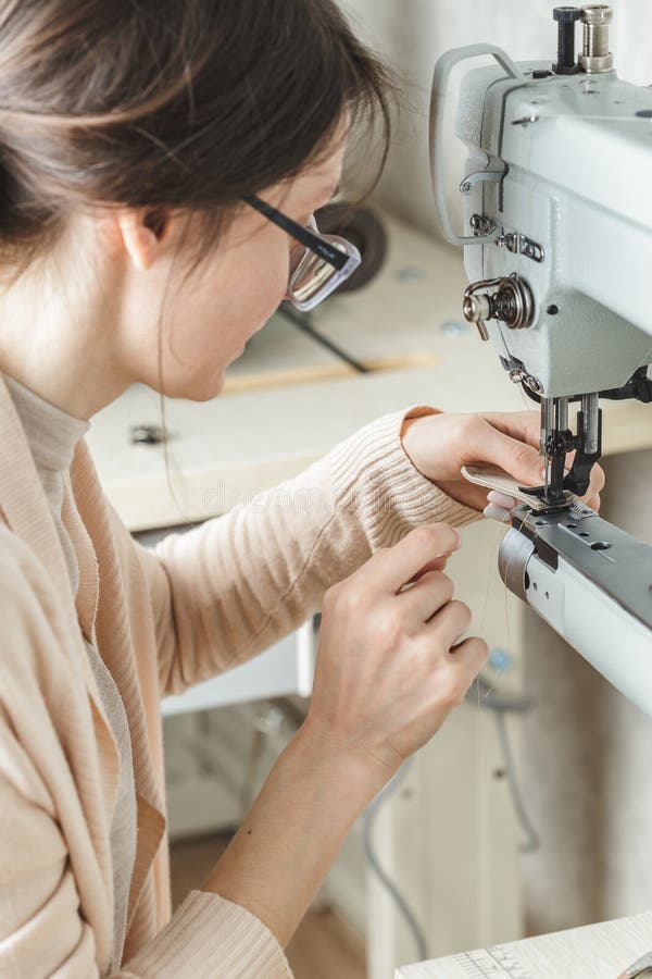 Woman Stitching Leather Using a Sewing Machine Stock Photo - Image of ...