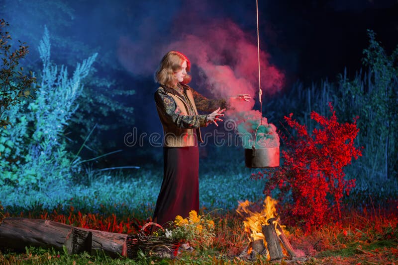 Witch by Fire in Night Forest Prepares Magic Potion Stock Photo - Image ...